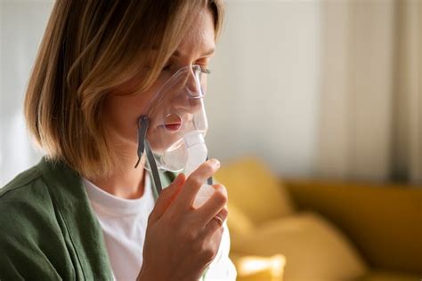 Free Photo Side View Woman Using Nebulizer