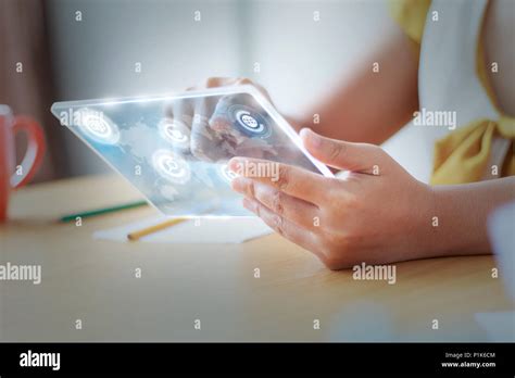 Close Up Shot Asian Woman Using Clear Tablet For Futuristic Cyber