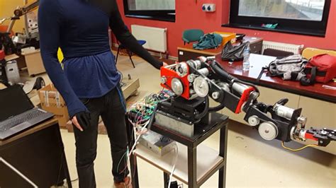 A Real Time Control Of Six Axis Robot Arm Using Wearable Flexible