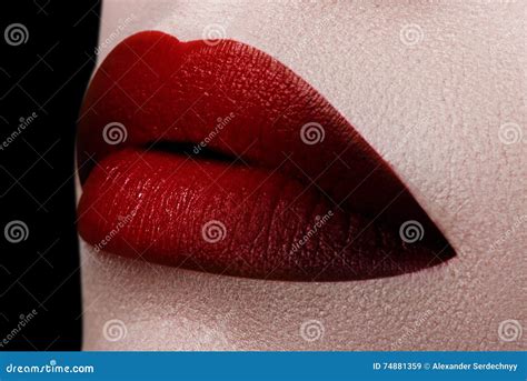 Extreme Close Up On Model With Dark Red Lipstick Makeup Stock Image