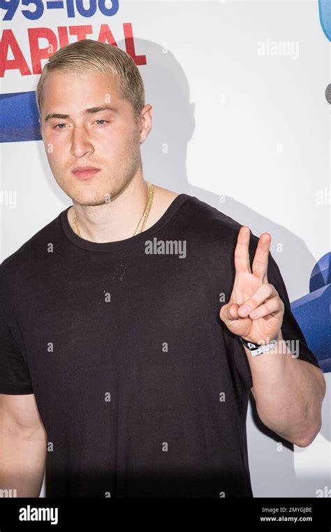 Singer Mike Posner Poses For Photographers Before Performing On Stage