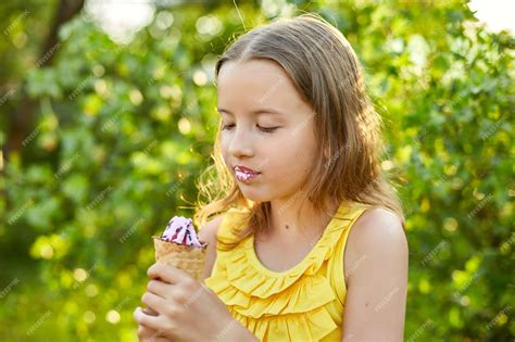 Premium Photo Happy Girl With Braces Eating Italian Ice Cream Cone
