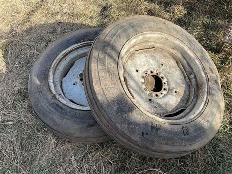 Two Implement Tires With Rims And Two Fluid Legacy Auction Company