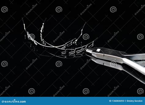 Orthodontics Tool Multiloop Braces System On Black Background Stock