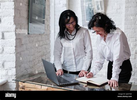 Two Business Women Talking And Working Together Teamwork Business Communication Start Up