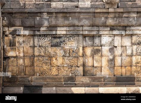 Candi Mendut Magelang Indonesia May 22th 2024 A Wall With A Pattern Of Brown And Gray