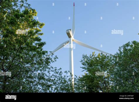 Windturbine With Trees Stock Photo Alamy
