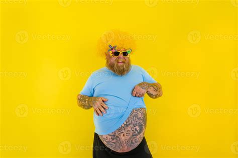 Fat Man With Wig In Head And Sunglasses Shows Off Her Big Belly