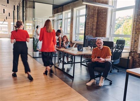 A Diverse Group Of Business Professionals Collaborates In A Modern