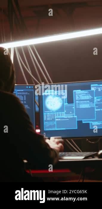 Vertical Video Hacker In Dark Neon Lit Underground HQ Coding Malware
