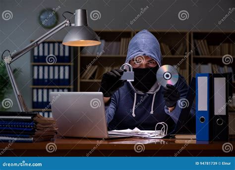 The Hacker Stealing Personal Data From Home Computer Stock Image
