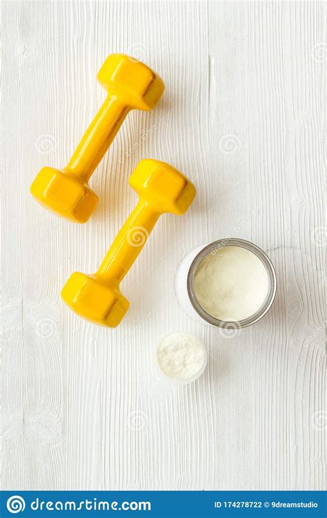 Sport Diet Protein Shake Near Dumbbells On White Background Top Down