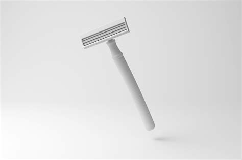 흑백과 미니멀리즘으로 공중에 떠 있는 흰색 트리플 블레이드 일회용 면도기 남성의 몸단장과 적절한 위생 습관의 개념에 대한 그림 면도날에 대한 스톡 사진 및 기타 이미지