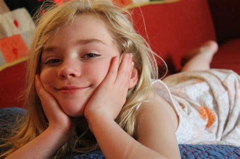 Premium Photo Portrait Of Cute Girl Lying On Bed