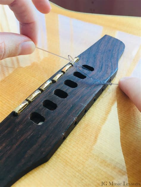 How To Change Strings On An Acoustic Guitar Nylon JG Music Lessons