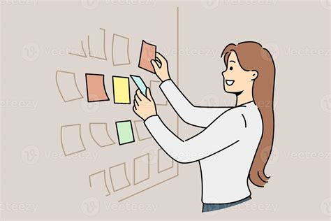 Business Woman Stands Near Scrum Board With Stickers And Is Engaged In Kanban Task Planning