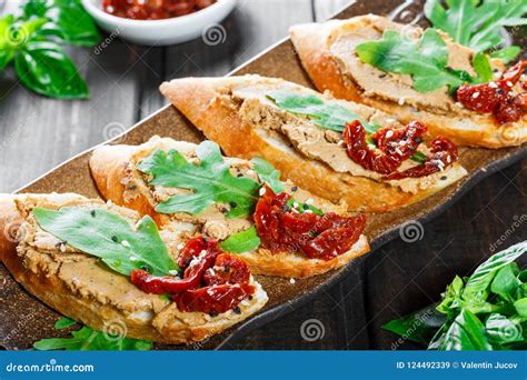 Italian Sandwiches Bruschetta With Meat Pate Arugula Sun Dried