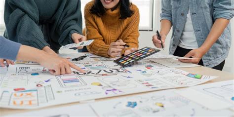 Ux Ui Development Team Discussing Meeting Working Together At Working Table In Office Stock