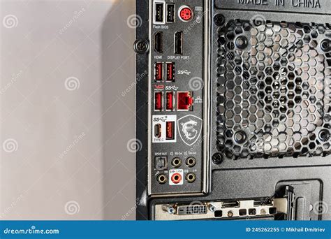 The Back Of A Personal Computer System Unit Black Case With Ventilation Grille And Connectors