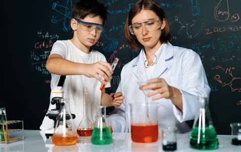 Teacher Support Babebabe Mixing Solution In Laboratory STEM Class Erudition Stock Image