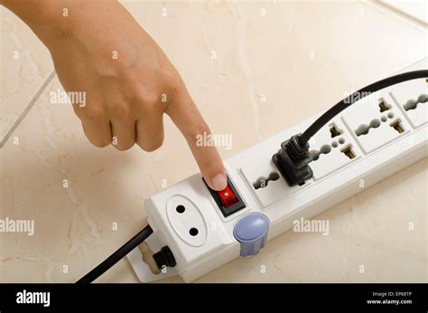 Asia Woman Hand Turn On Switch Multiple Socket Plug Electric Stock Photo Alamy