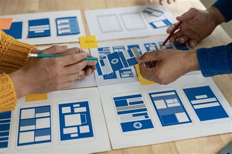 A Team Of Web Designers With The Ux Ui System Are Writing Programs And Layers To Customize The