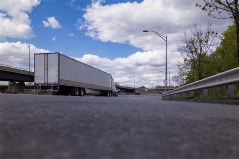 Premium Photo A White Truck Is Parked On The Side Of The Road In