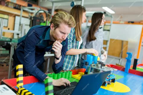 Premium Photo Young People In The Robotics Classroom