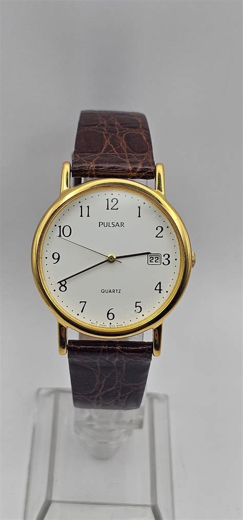 A Vintage Gold Tone Pulsar By Seiko Classic Mens Watch White Dial