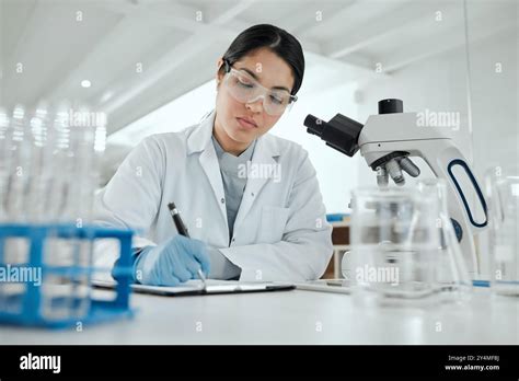 Laboratory Woman And Scientist With Clipboard For Writing Treatment
