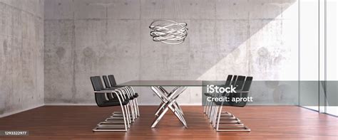 밝은 조명의 현대적인 회의실에는 대형 유리 테이블과 10개의 사무실 의자 객실 높이 창문 현대적인 천장 램프 2개 빈 콘크리트 벽이 있습니다 3d 렌더 이사회실에 대한 스톡