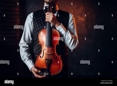Portrait Of Male Person Holding Wooden Violin Fiddler With Musical Instrument Stock Photo Alamy