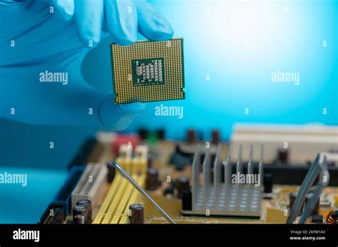 Electronic Engineer Hand Holding Computer Chip Chipset Of Electronic