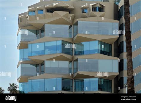 Facade Of A Building In Catalonia With An Angular Design Where Glass