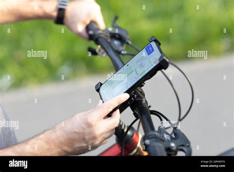 Man Planning Route Using Gps Navigation Application In Mobile Phone On
