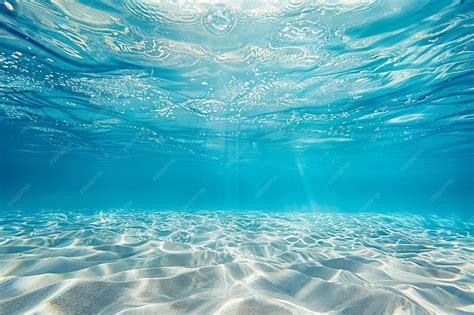 Premium Photo A Clear Blue Water With The Ocean And The Sun Shining