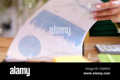 Female Hands On Keyboard In Front Of Computer Screen With Financial Data And Charts Data