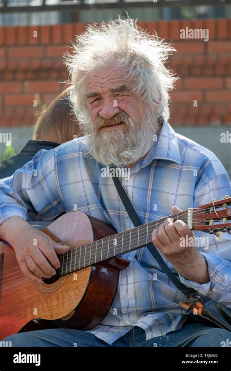 Elderly Man Playing Guitar S