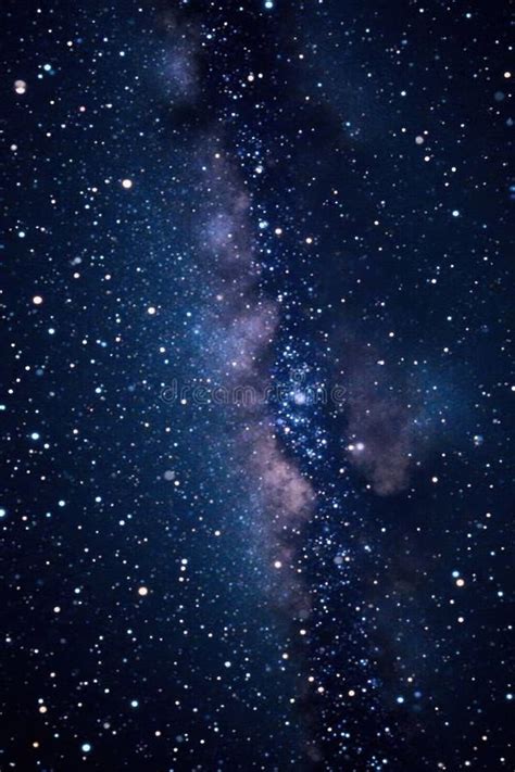 Dense Starfield Against A Dark Canvas Twinkling With Varying