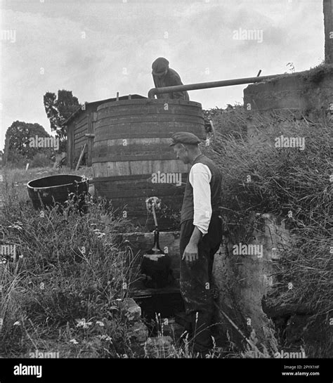 Men At The Production Of Tar After The Process Of Pyrolytic Decomposition In The Furnace Is