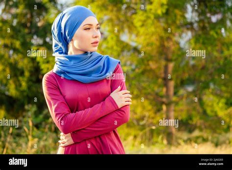 Islamic Beautiful Woman In A Muslim Virgin Dress Standing On A Summer