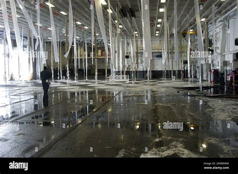 Us Navy Damage Controlman 1st Class Checks To Ensure Nozzles Are Emitting Aqueous Film Forming Us Navy Damage Controlman 1st Class Checks To Ensure Nozzles Are Emitting Aqueous Film Forming