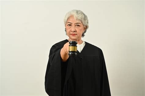 Premium Photo Strict Senior Female Judge Dressed In Robe Gown Uniform With Gavel Hammer Mallet