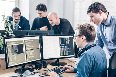 Premium Photo Startup Business Problem Solving Software Developers Working On Desktop Computer