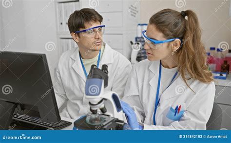 Microscope With Computer Monitor On Desk Royalty Free Stock Image 263612872