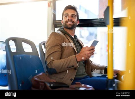 Looks Like My Stop A Handsome Young Man Sending A Text Message During His Morning Bus Commute