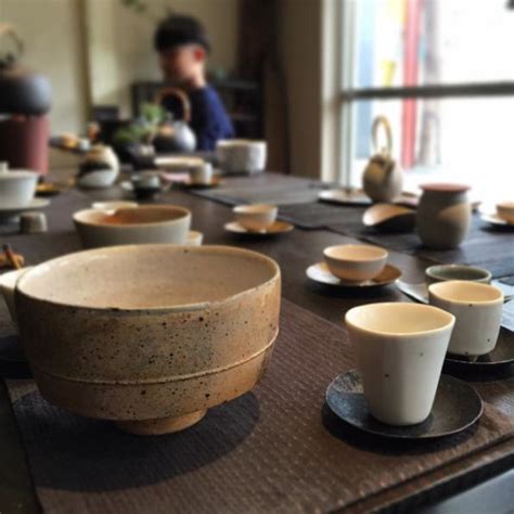 Bowls And Cups Are Sitting On The Table