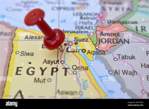 Red Push Pin Pointing On Location Of Cairo World Map Close Up View