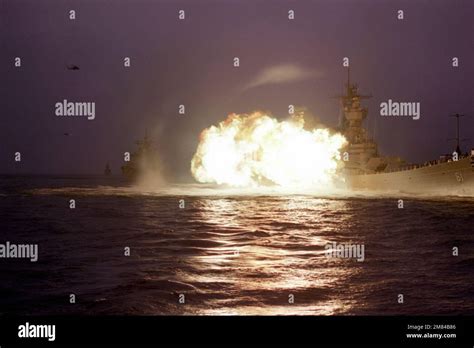 A Starboard Bow View Of The Battleship Uss Iowa Bb 61 Firing A Broadside During Nato Exercise