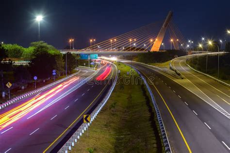 A Long Exposure Captures The Dynamic Flow Of Traffic On A Multi Lane Trans Jawa Highway At Night